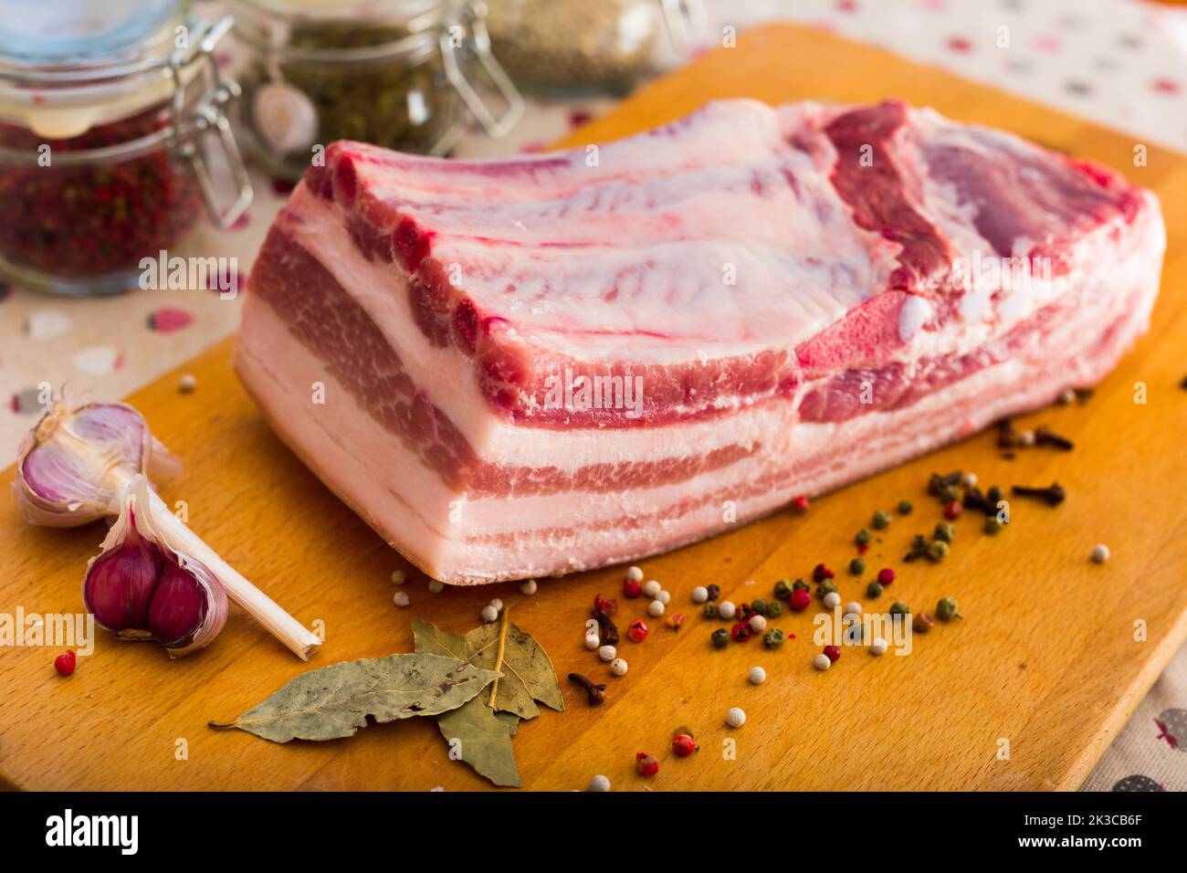 cooking traditional homemade lard with spices. pork belly with layer on ...
