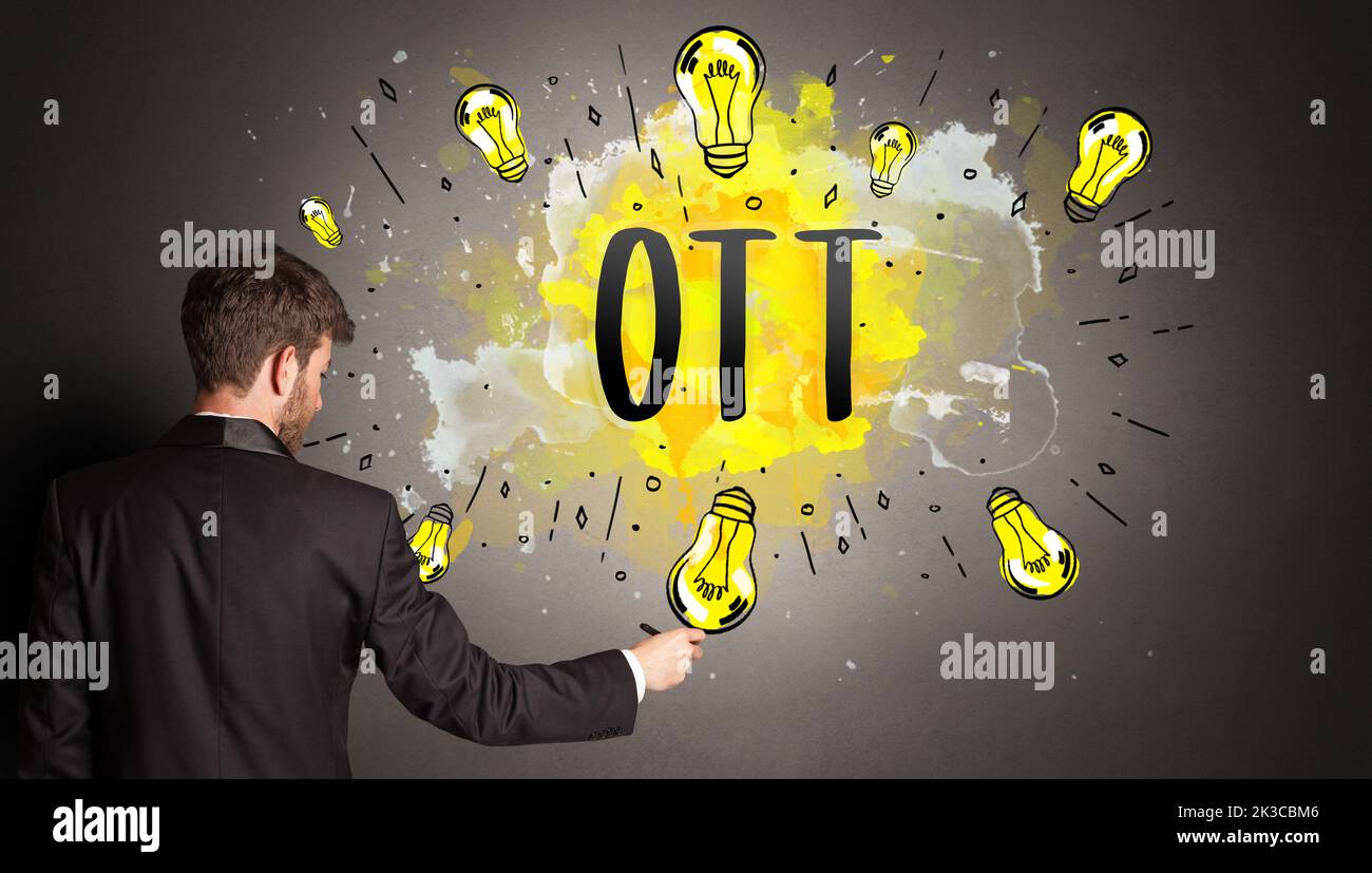 man drawing colorful light bulb Stock Photo - Alamy