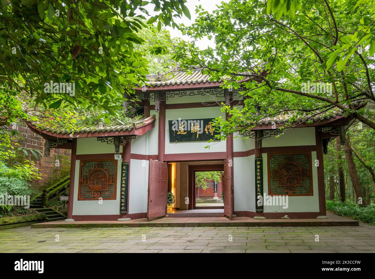 A landscape of ancient pagan buildings at the foot of a mountain in ...
