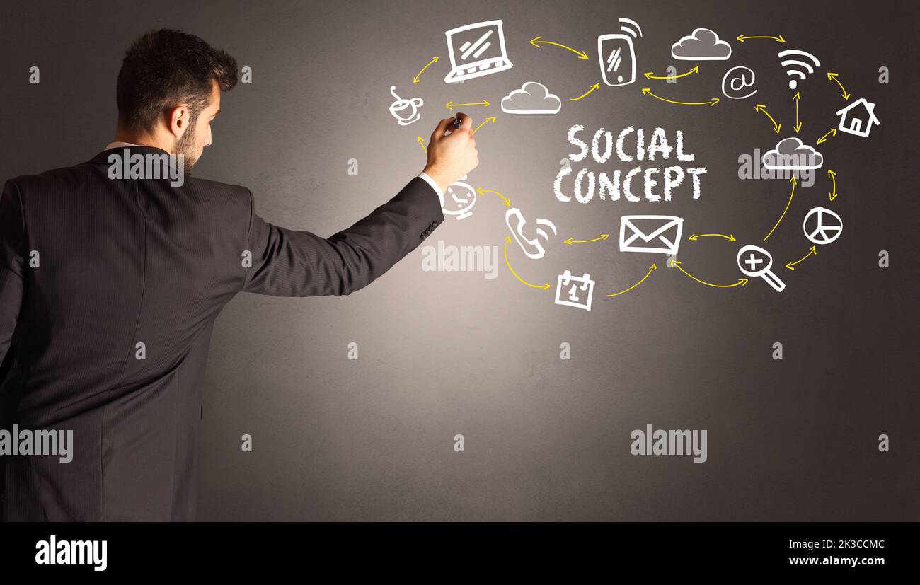businessman drawing social media icons Stock Photo - Alamy