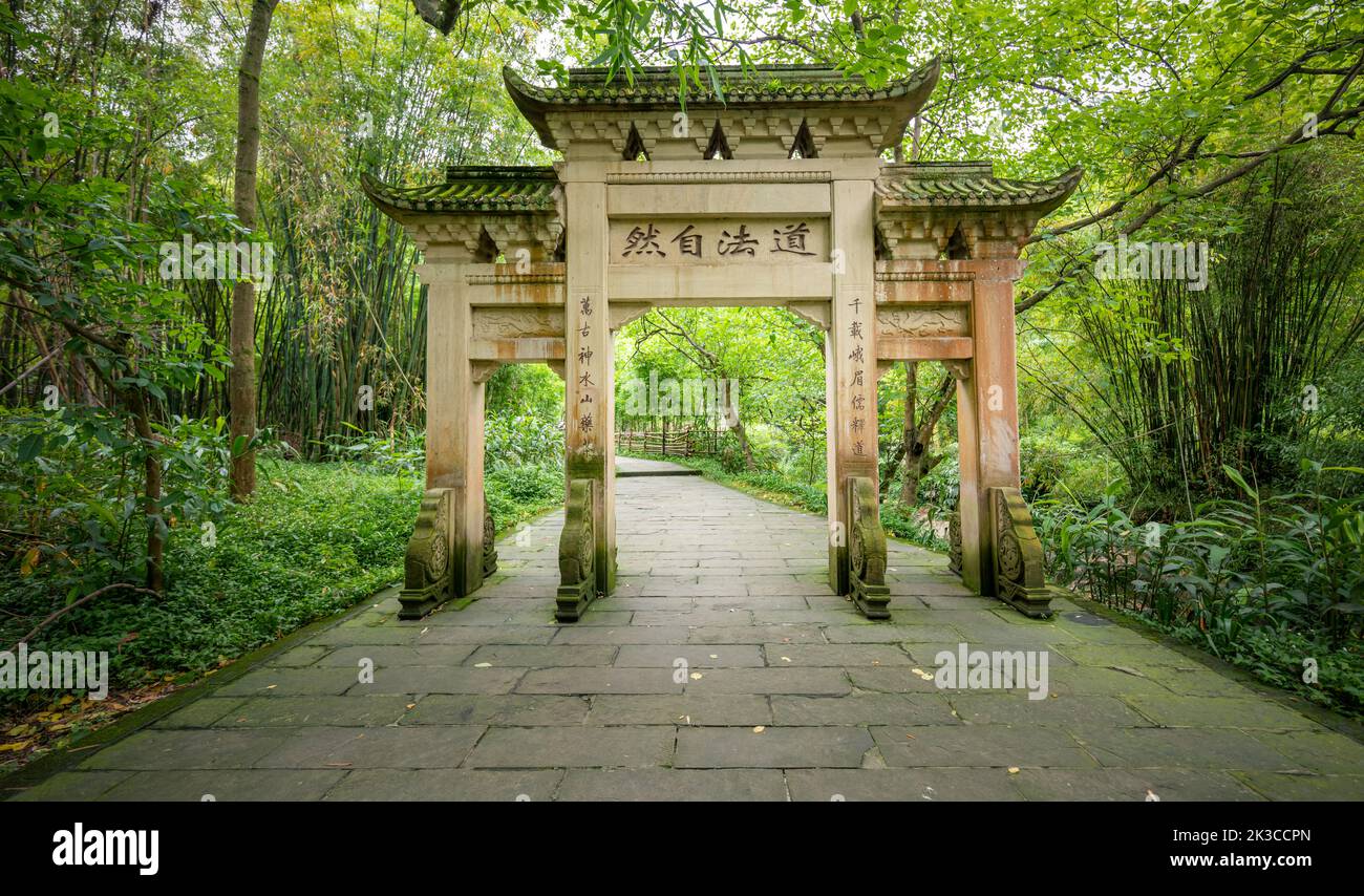 A landscape of ancient pagan buildings at the foot of a mountain in ...