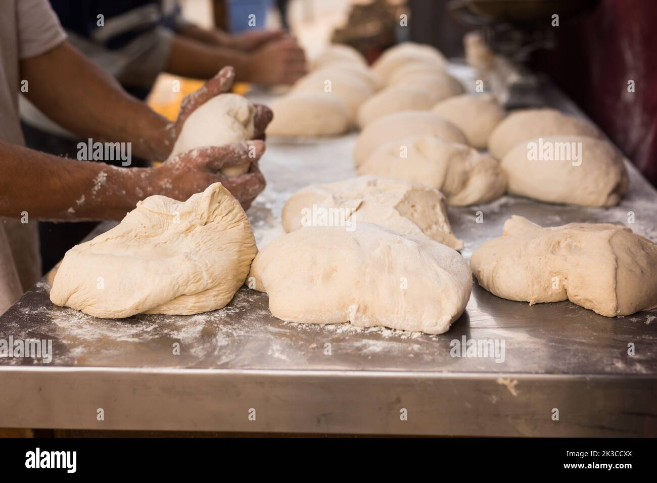 process of making bread. dough kneading Stock Photo - Alamy