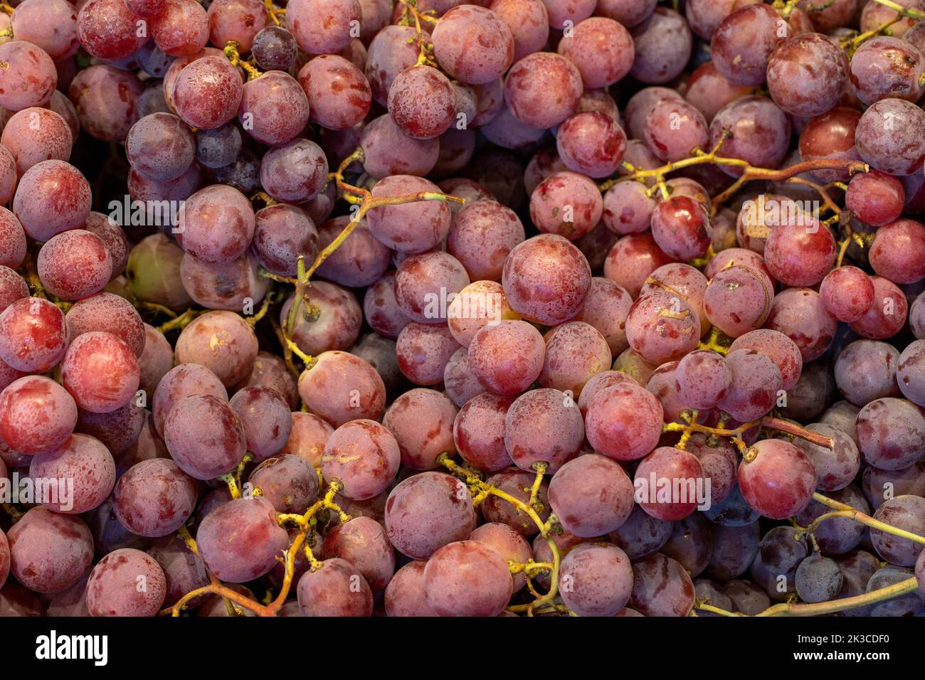 Bunch of grapes on the market counter. Pile of ripe grapes Stock Photo ...
