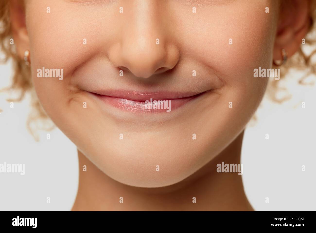 Cropped image of little girl face. Macro, close up parts of face. Chin ...