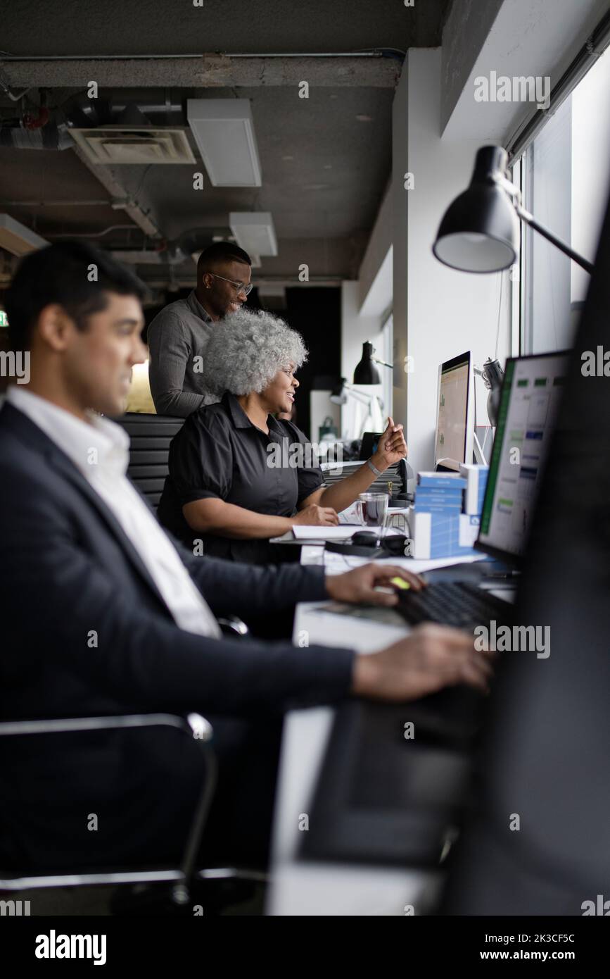 Working with two computers hi-res stock photography and images - Alamy