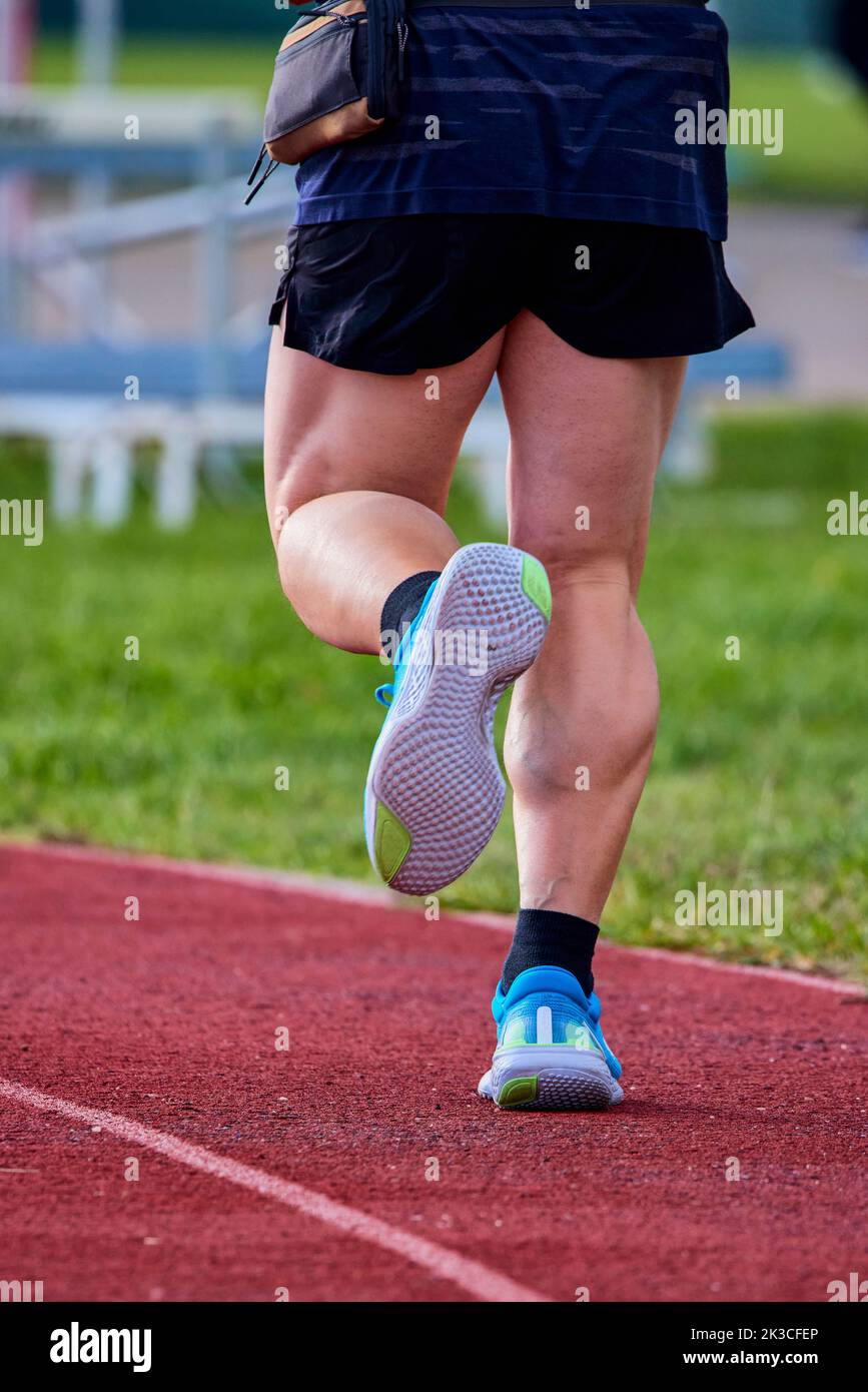 A man running on a running track Stock Photo - Alamy