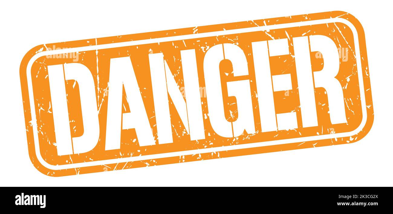 DANGER text written on orange grungy stamp sign Stock Photo - Alamy