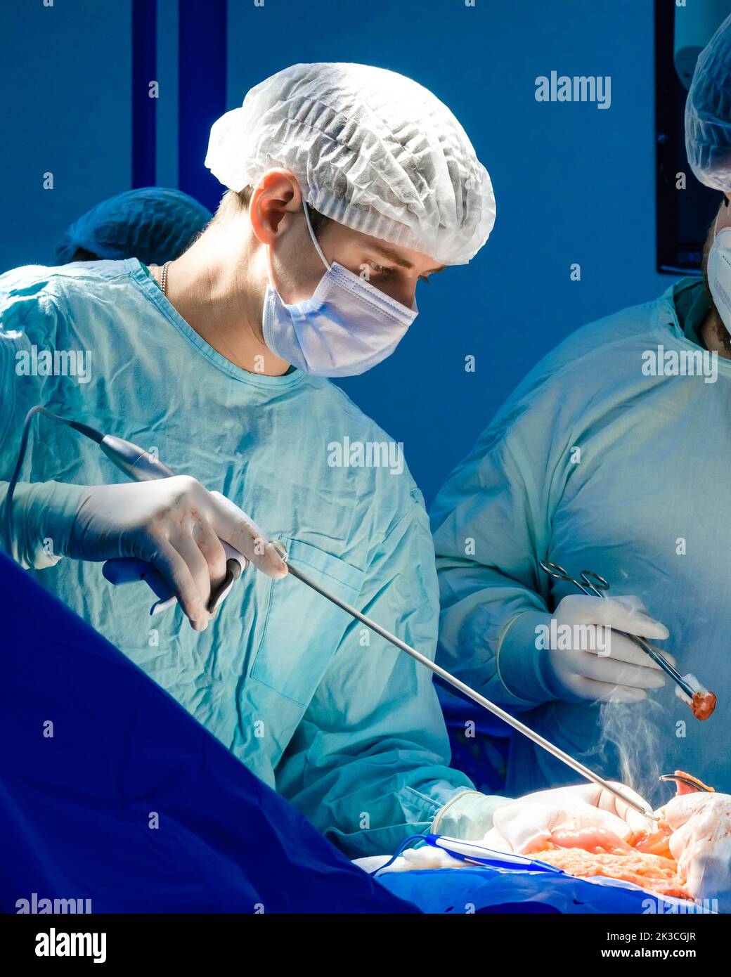 The surgeon operates the patient with surgical instruments. Portrait of ...