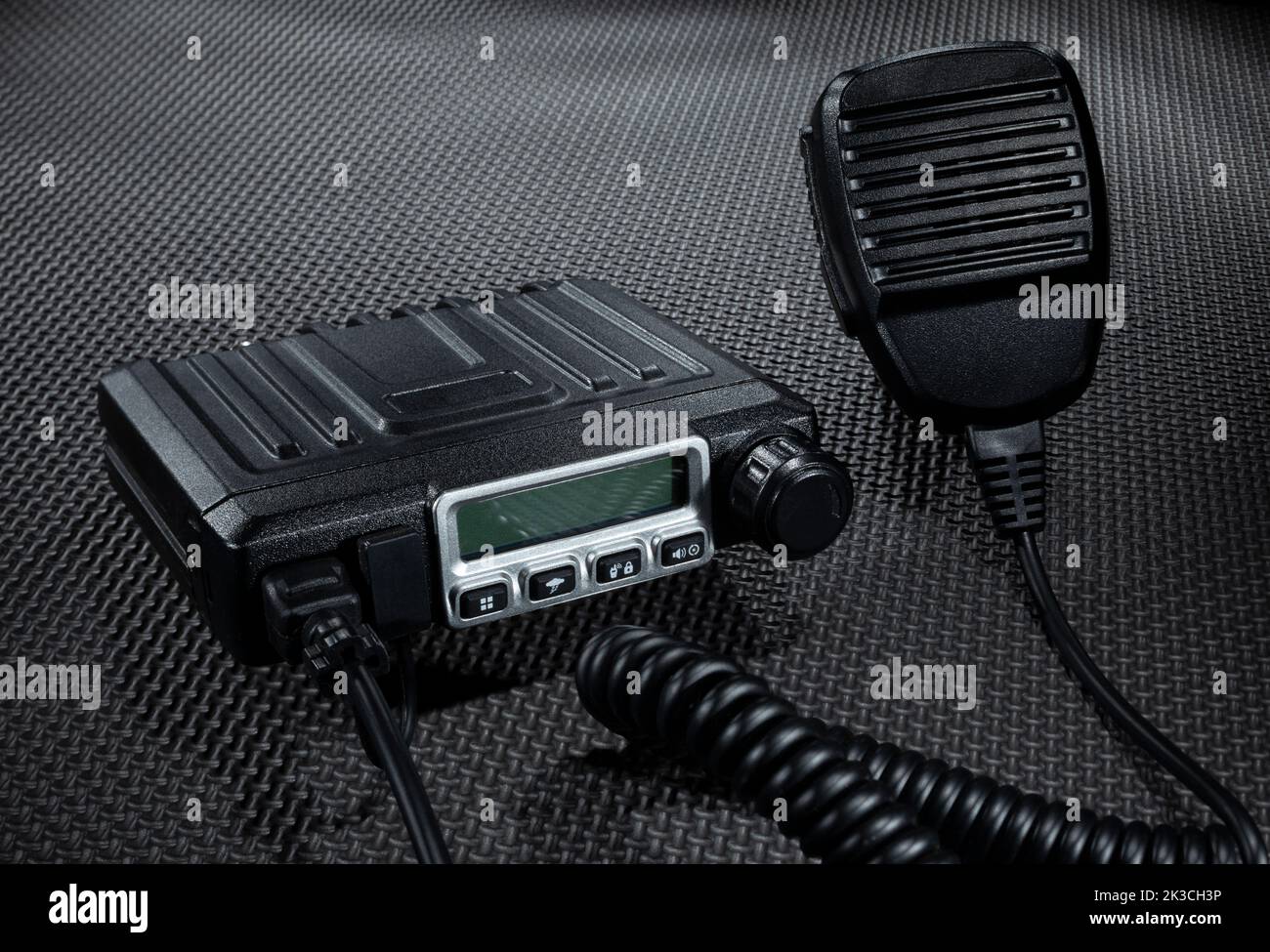 Two way radio with microphone and cord on a rubber mat Stock Photo - Alamy