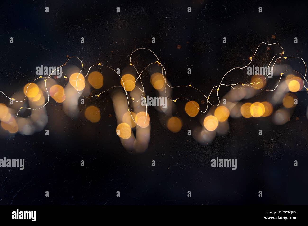 Fairy lights, led garland, blurred overhead flat lay shot with bokeh on ...