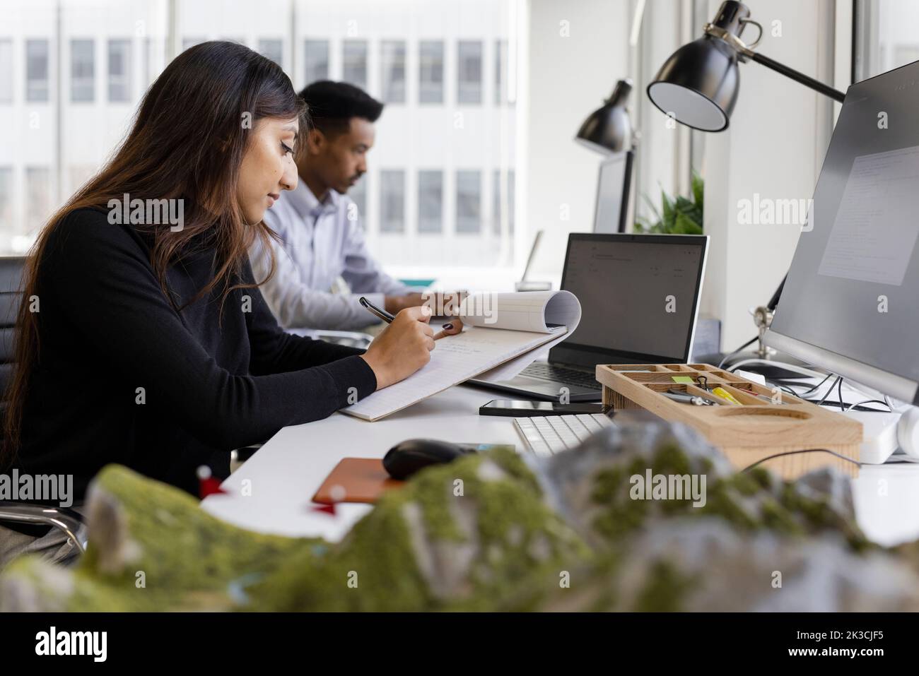 Female architect at her desk hi-res stock photography and images - Alamy