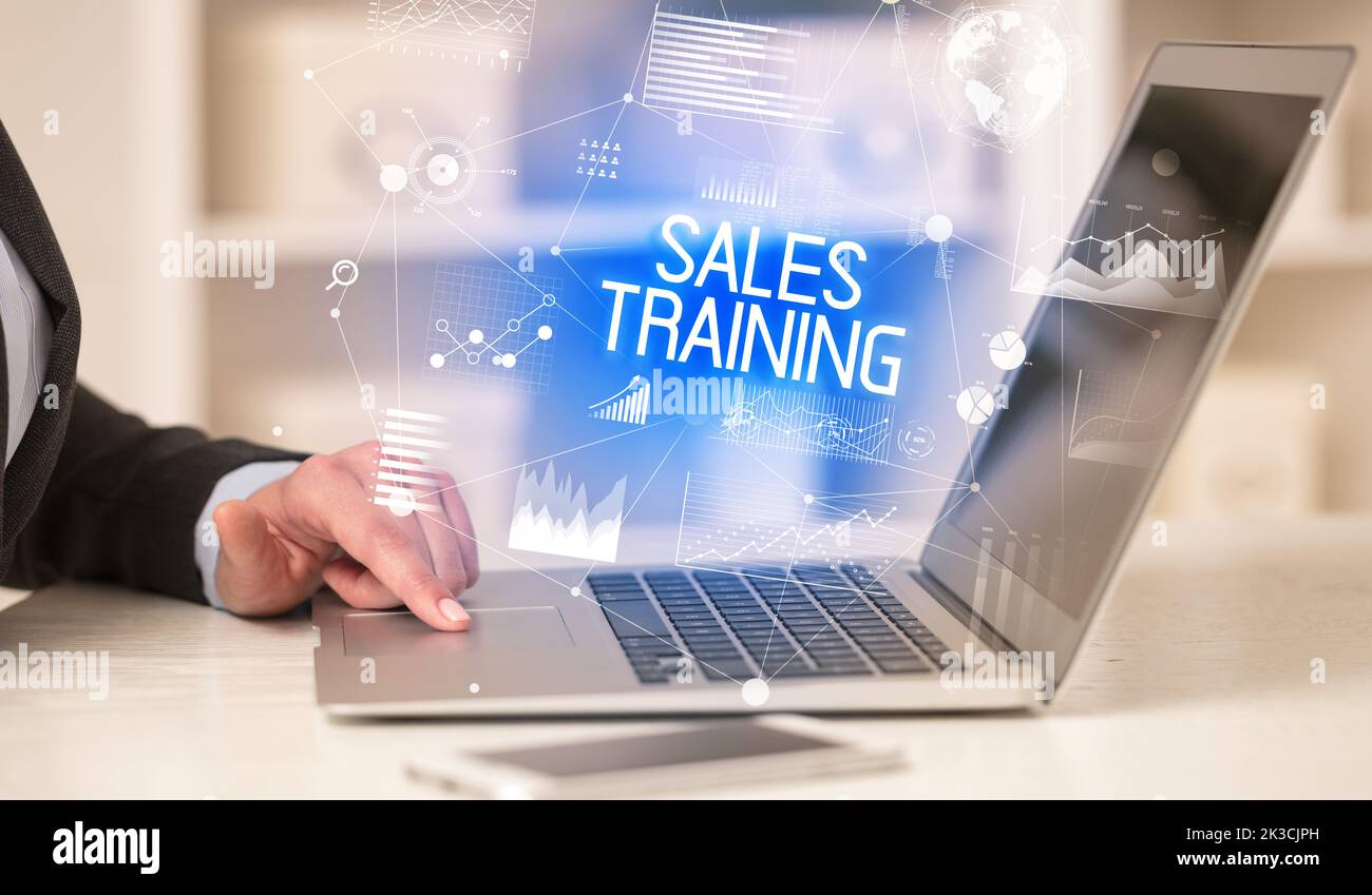 Side view of a business person working on laptop Stock Photo - Alamy