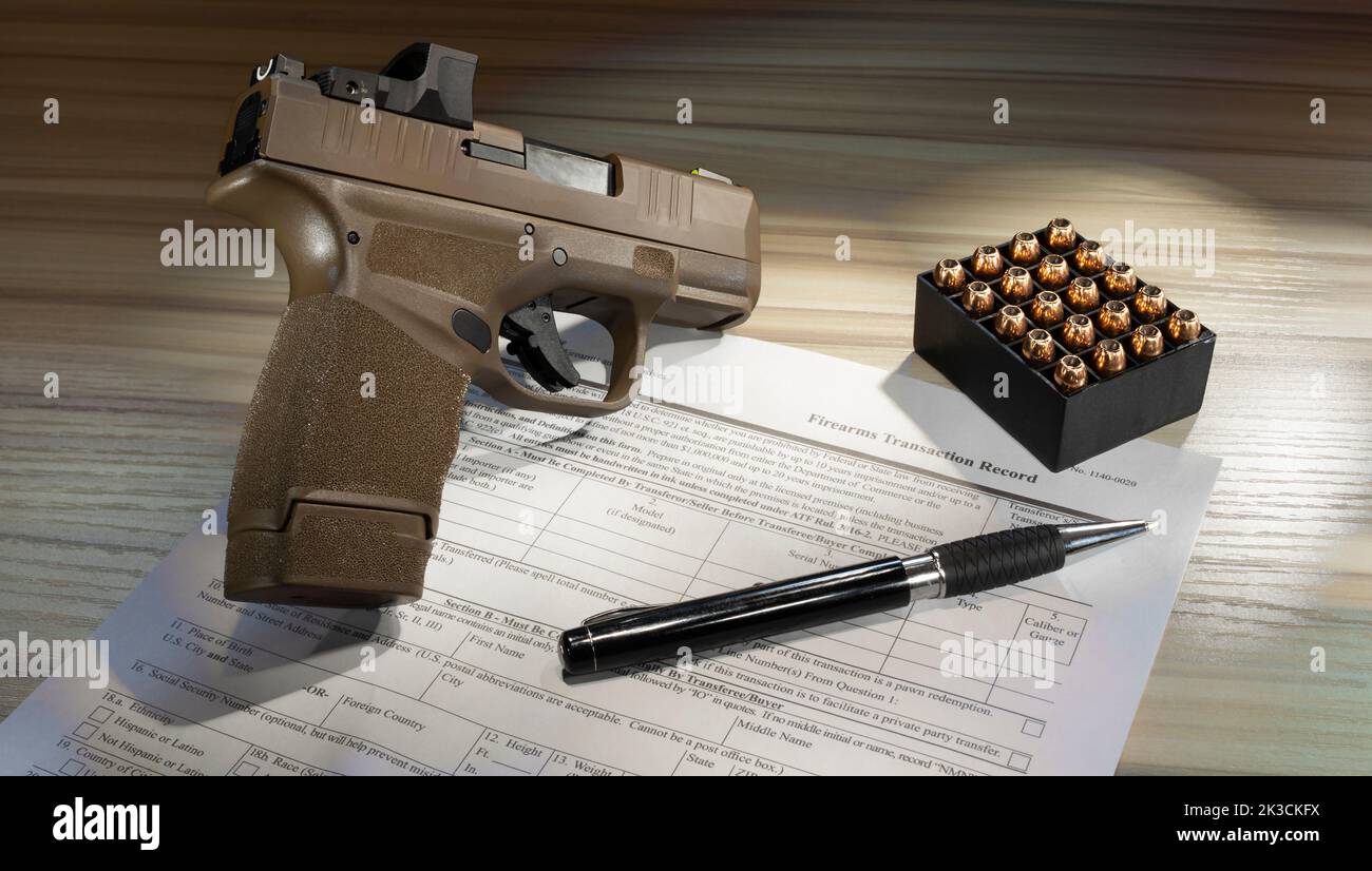 Public domain background check form 4473 with a pistol and ammo Stock ...