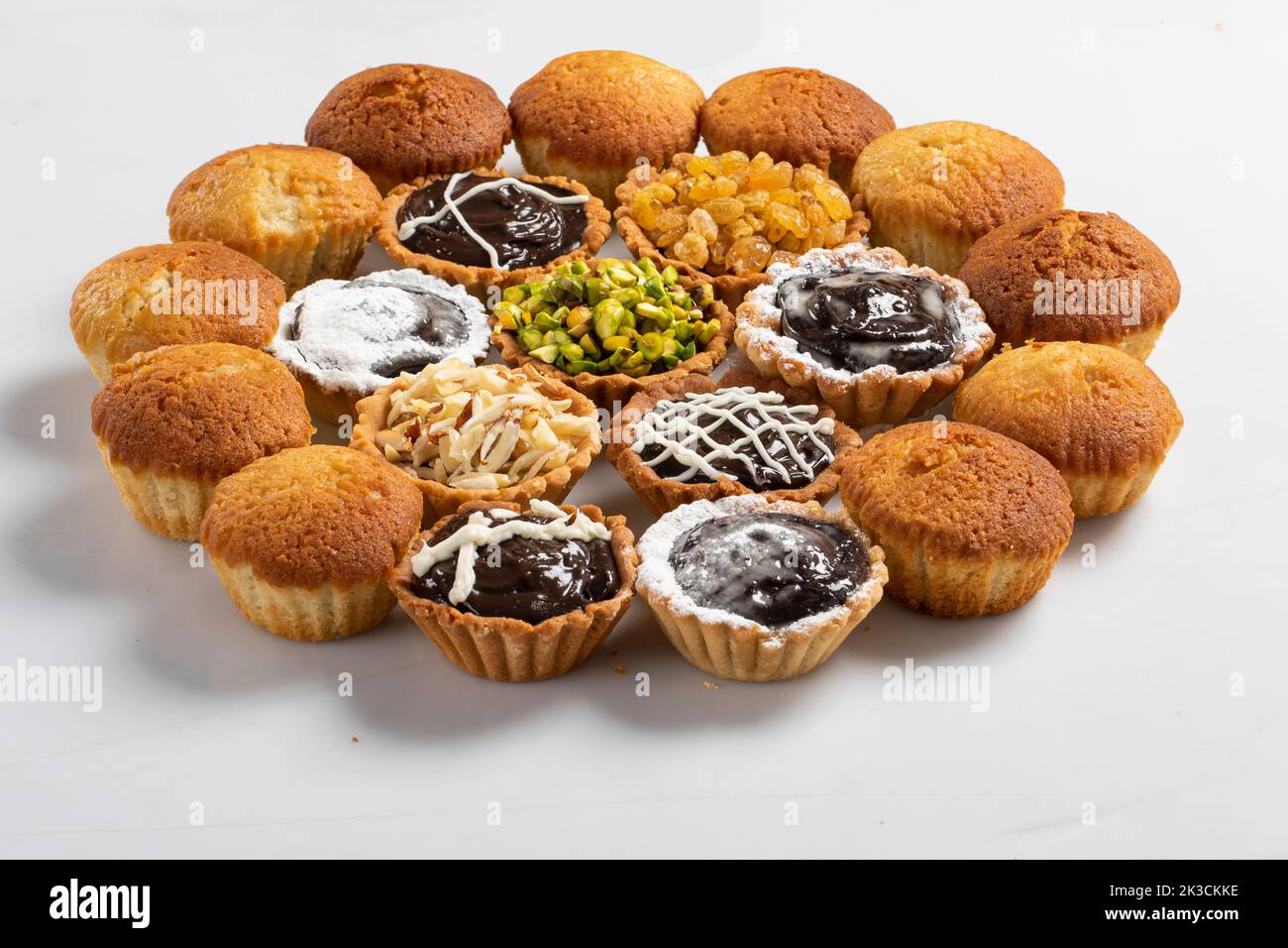 Group off muffin cake isolated on white background Stock Photo - Alamy