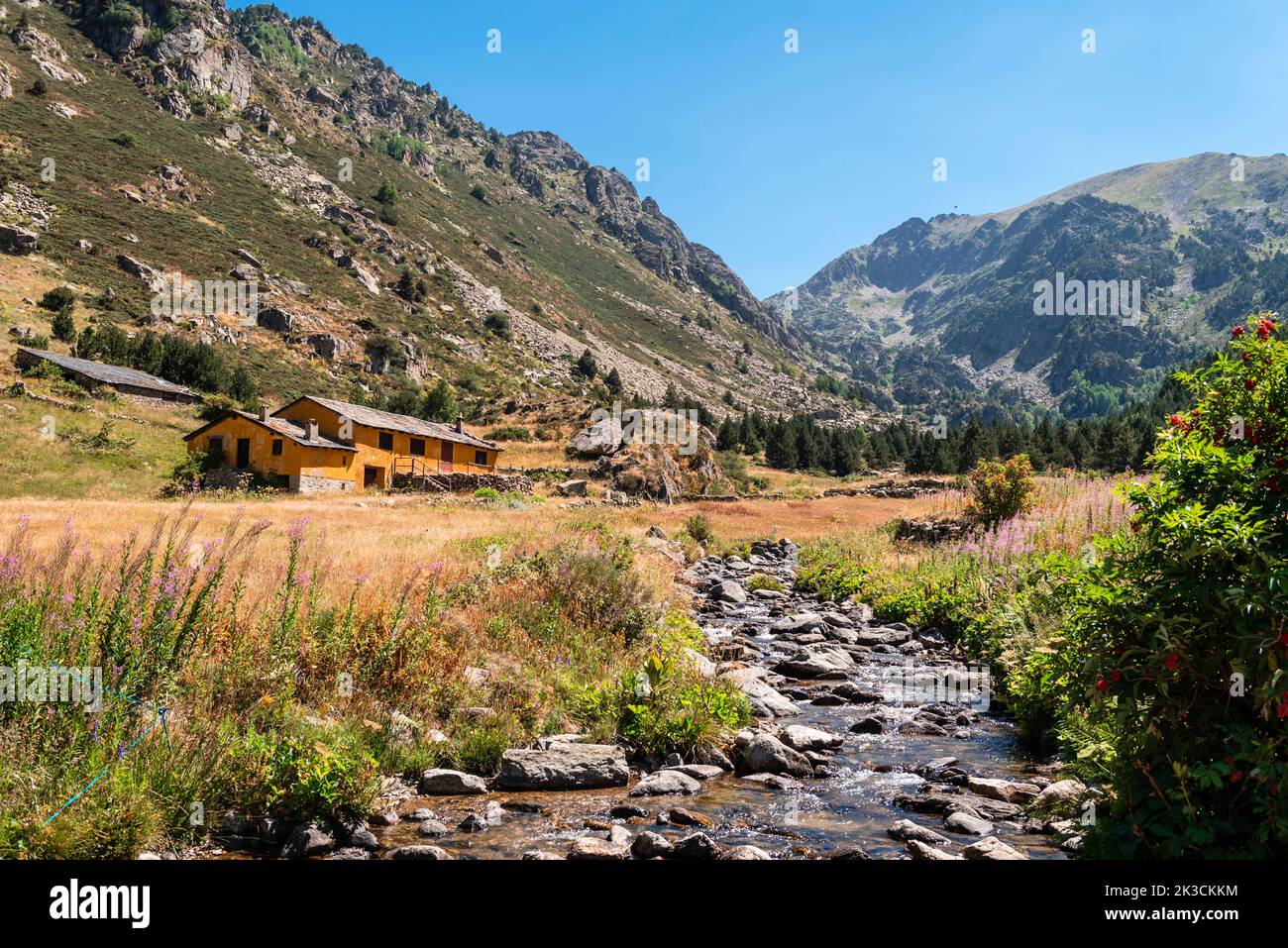 Valley between mountains with a river running through the valley and a ...