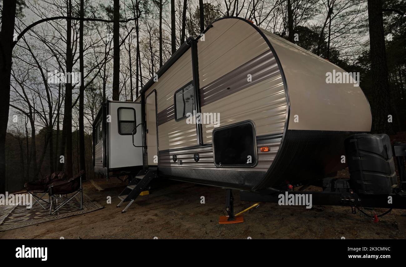 Evening falling over a camper trailer at Jordan Lake in North Carolina ...