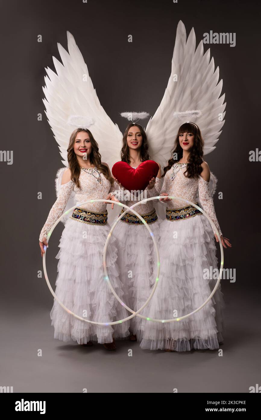 Happy women in angel costume Stock Photo - Alamy