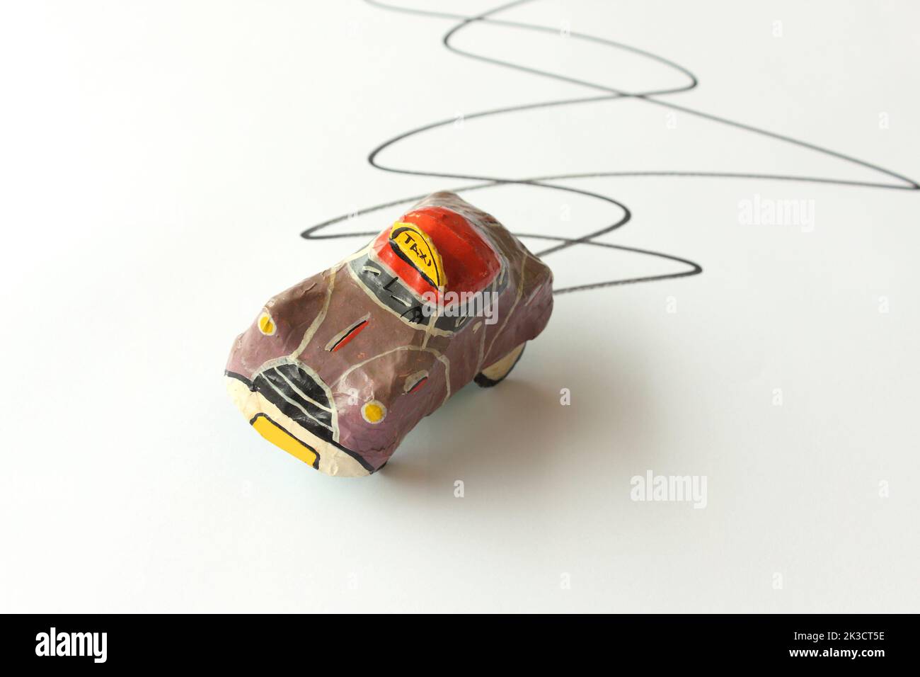 A closeup of a taxi car toy on a white background Stock Photo - Alamy