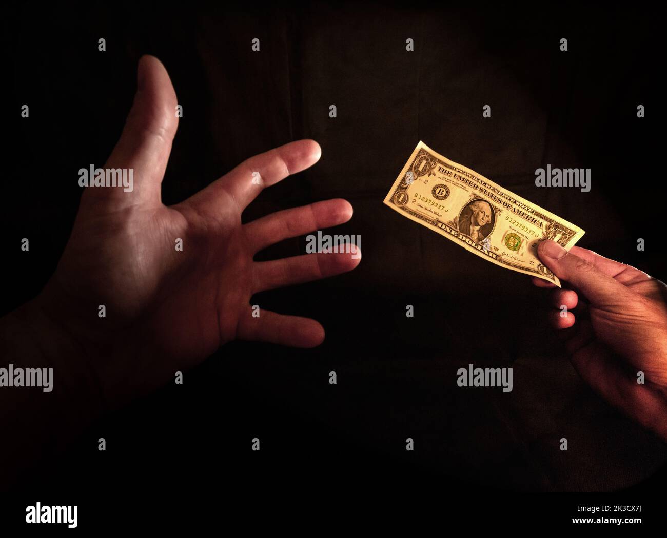 Handing a one dollar bill hi-res stock photography and images - Alamy