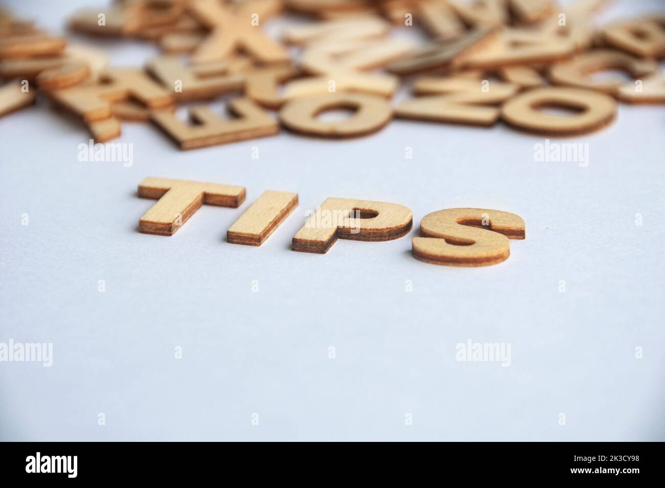 Tips wooden text on while cover background. Tips concept Stock Photo ...