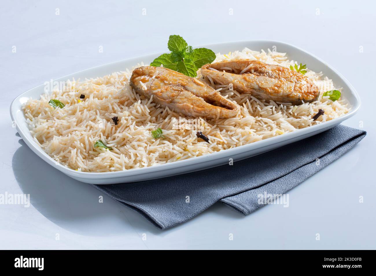 Homemade Fish Biryani served with Raita on traditional Copper Brass Pot ...