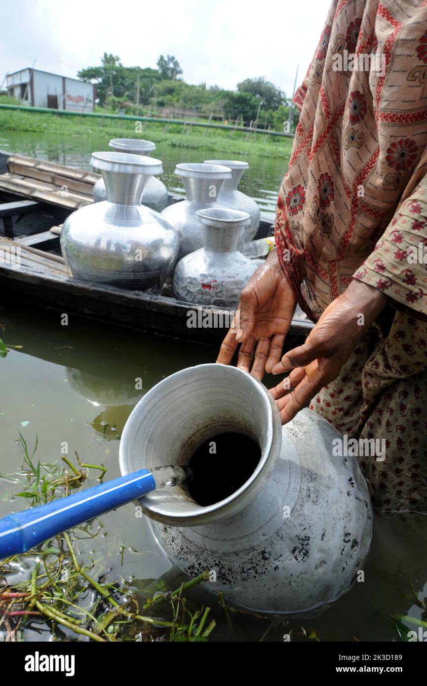 Dhaka, Bangladesh - July 16, 2010: Residents of Dhaka's Nandipara are ...
