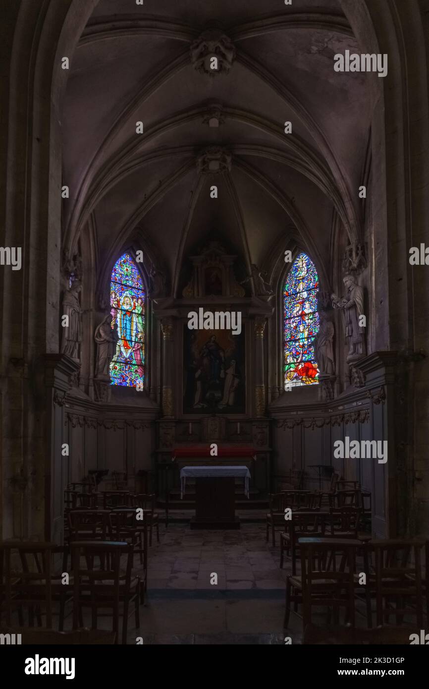 Interior of the Church of Notre-Dame with altar and colorful windows in ...