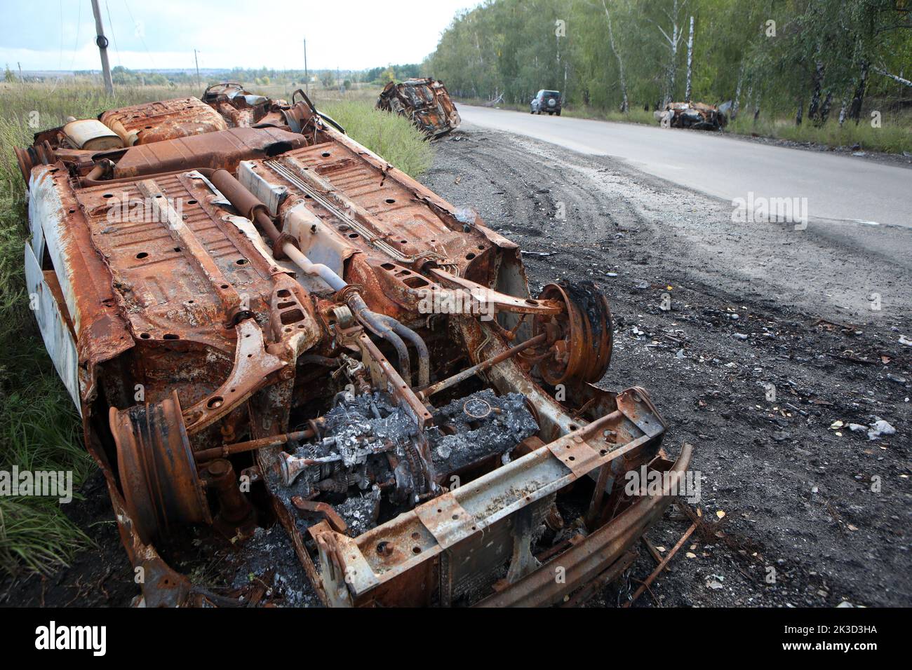 LYPTSI, UKRAINE - SEPTEMBER 24, 2022 - Burnt-out cars are left on the ...