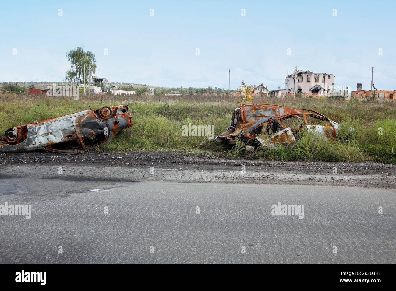 LYPTSI, UKRAINE - SEPTEMBER 24, 2022 - Burnt-out cars are left on the ...