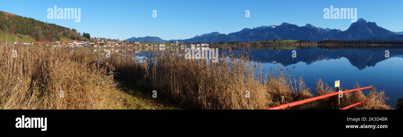 alpine landscape with scenic and calm lake Hopfensee and the Bavarian ...