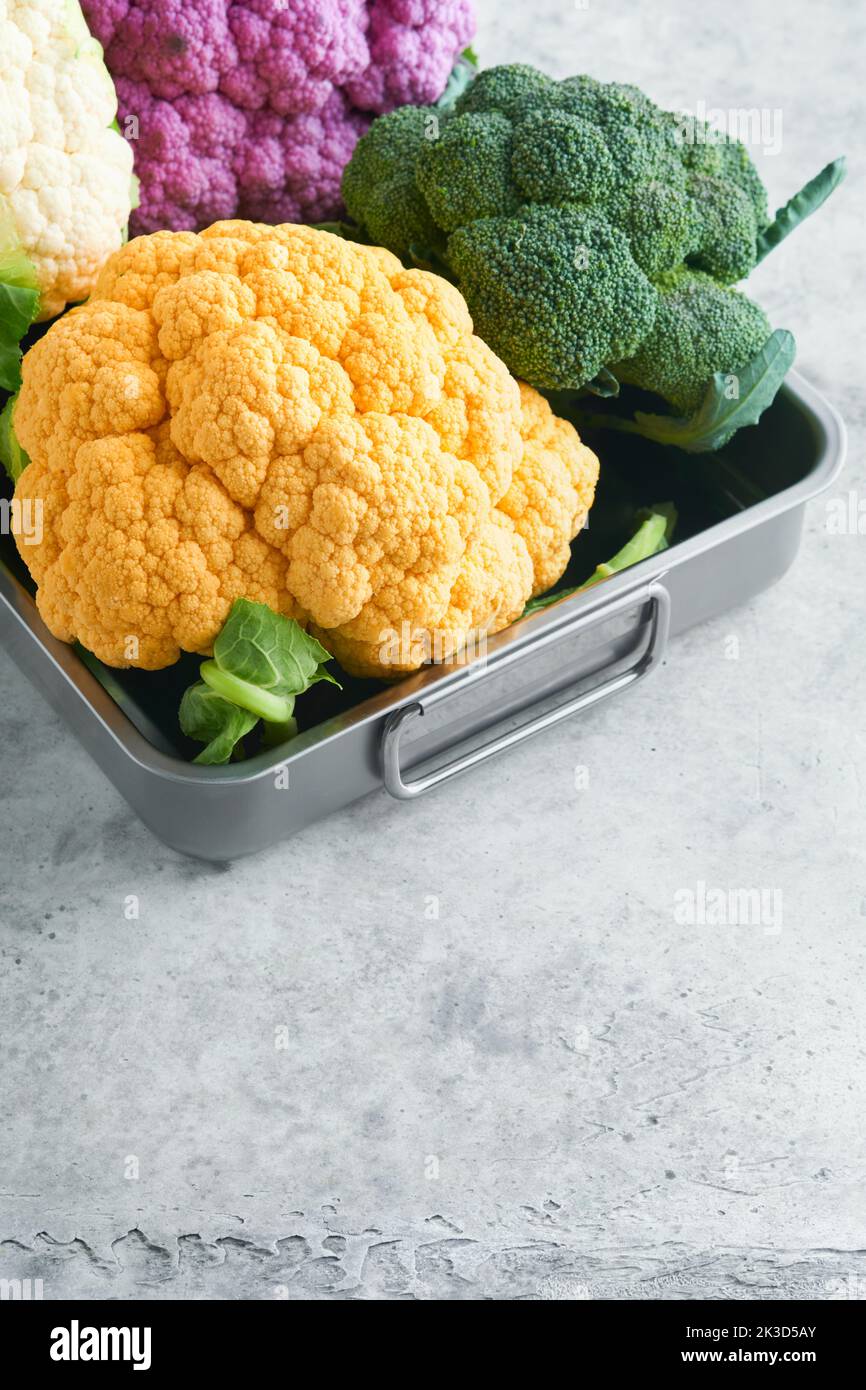 Colorfu cauliflower. Various sort of cauliflower on gray concrete ...