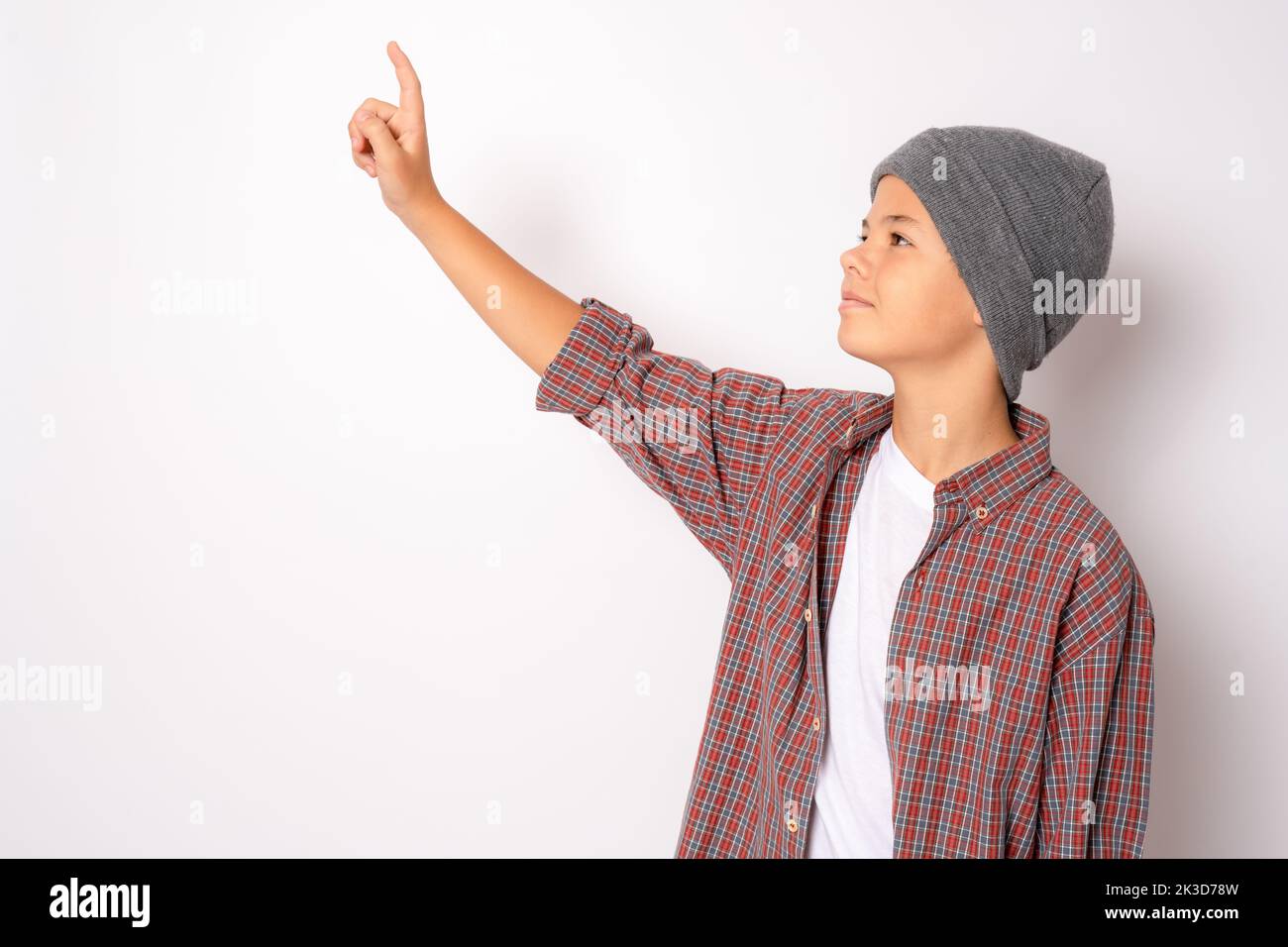 Portrait of cheerful boy with good idea - isolated over white ...