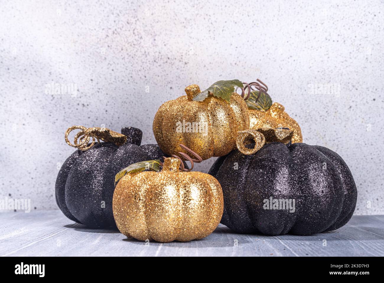 Black and cold colored pumpkins on gray wooden background. Minimalist ...