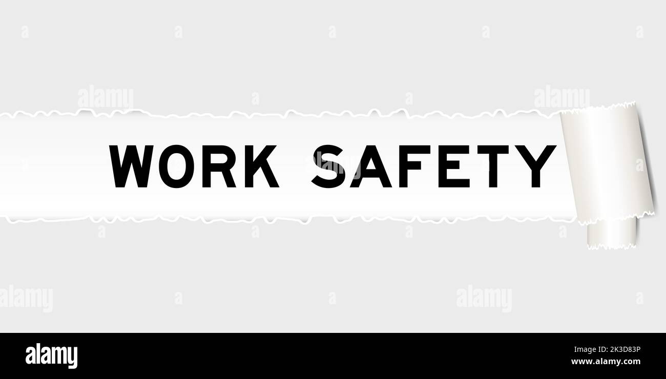 Ripped gray paper background that have word work safety under torn part ...
