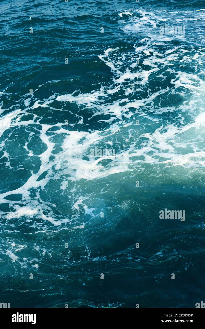 A vertical shot of a bright blue sea surface Stock Photo - Alamy
