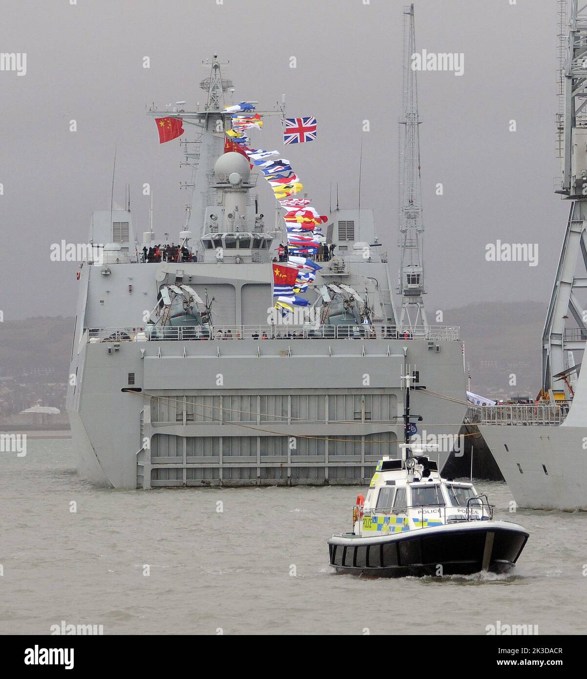 A police patrol boat alongside Chinese Assault ship Chang Bai Shan in ...