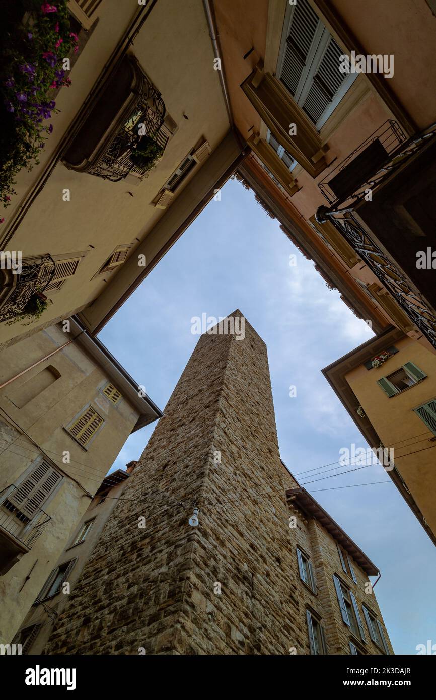 A vertical low angle shot of Torre del Gombito landmark and nearby ...