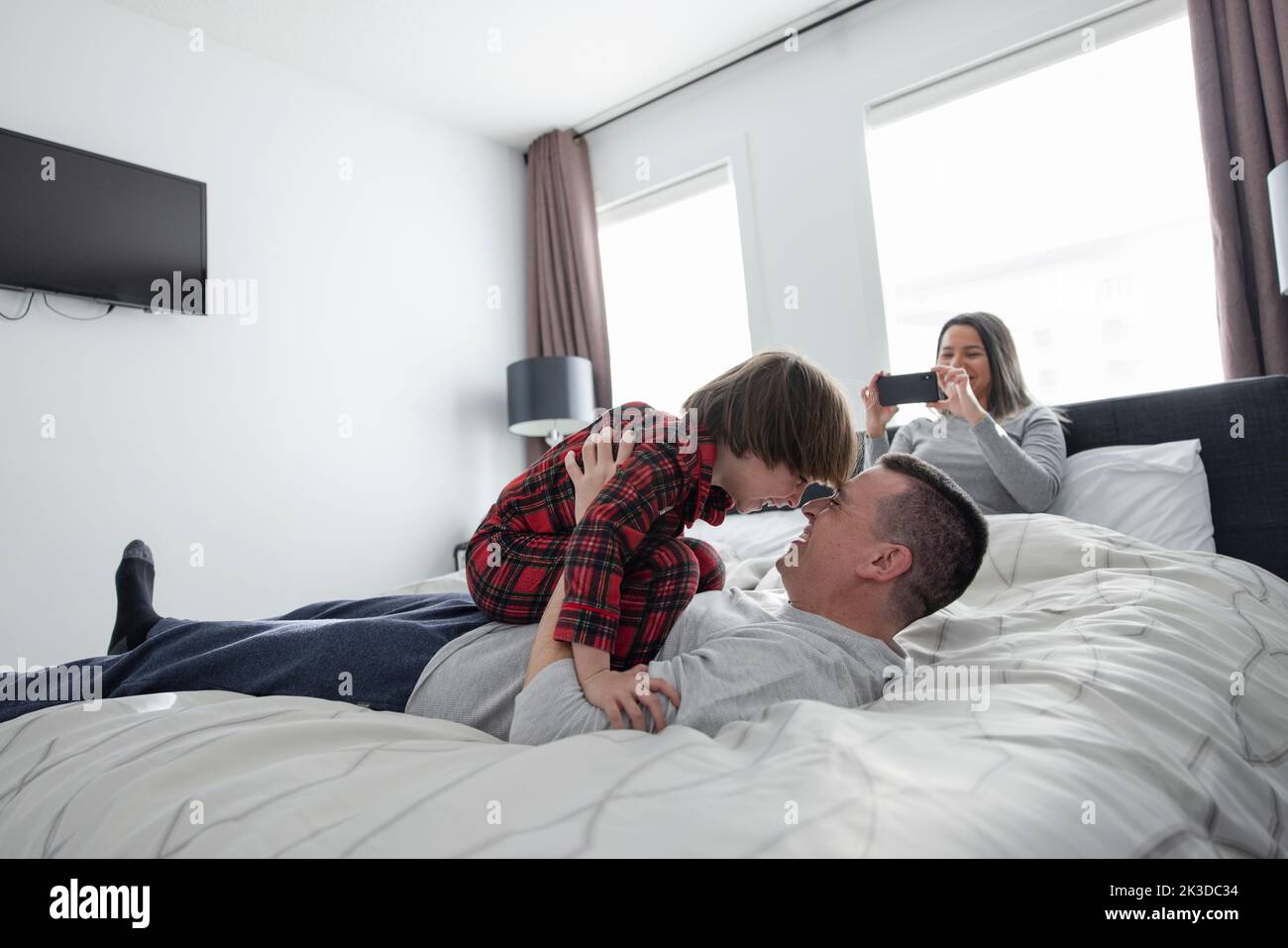 Man filming woman on bed hi-res stock photography and images - Alamy
