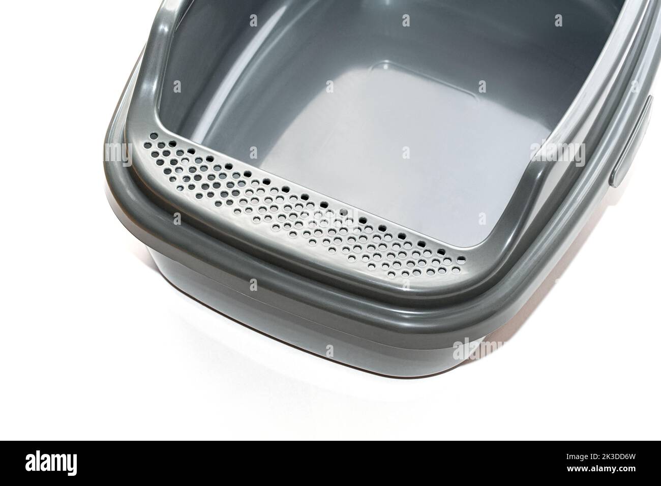 Gray toilet tray for cats on a white background Stock Photo - Alamy