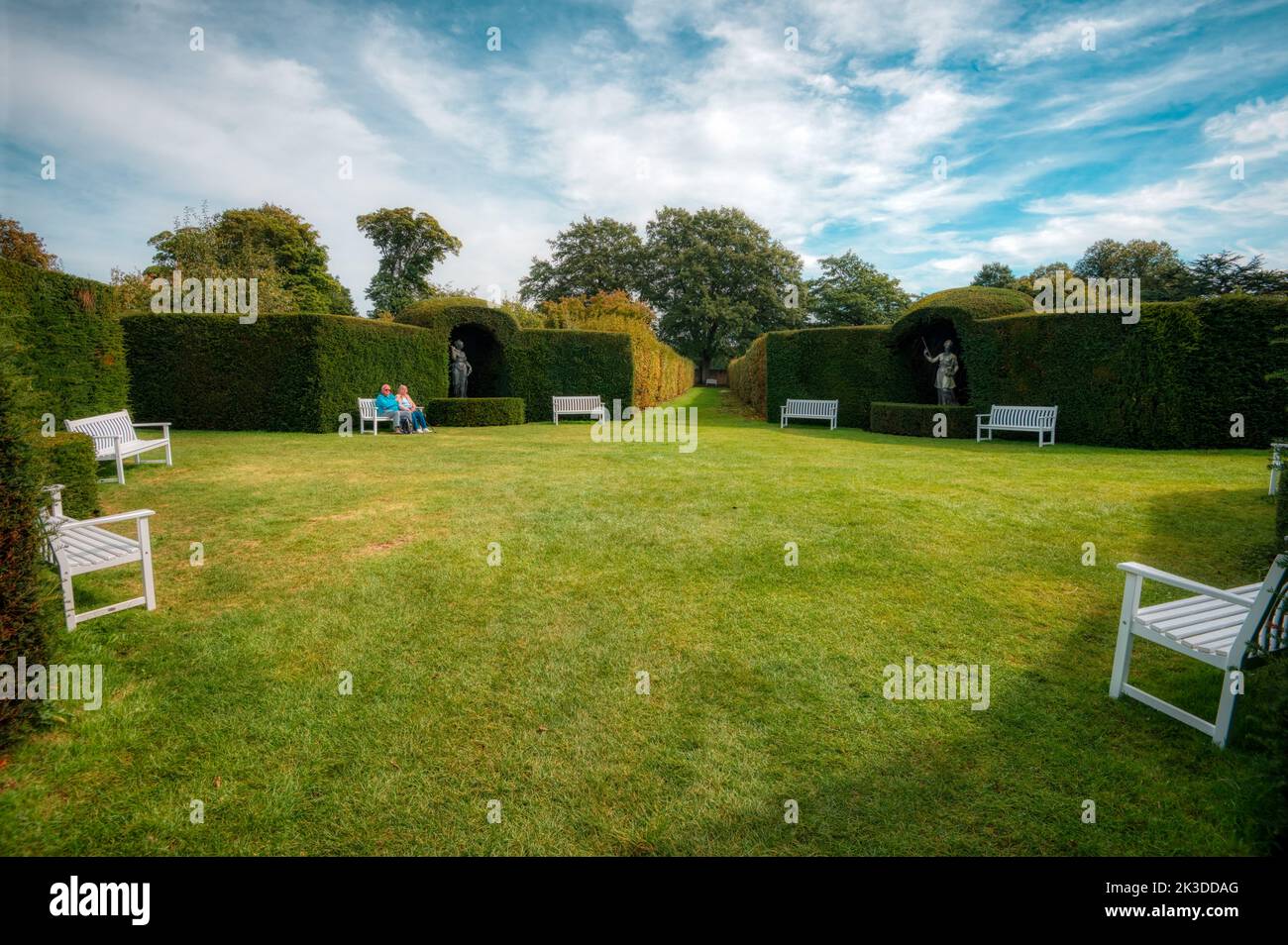 Couple in the garden. Garden seats in the formal garden at Hardwick ...