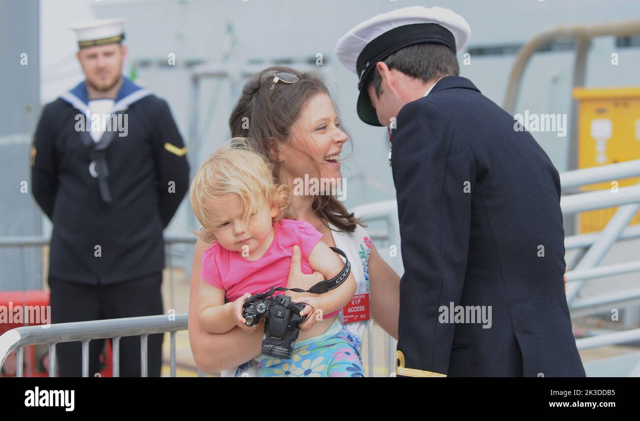 Commanding officer Steve Banfield greets his wife georgie an daughter ...