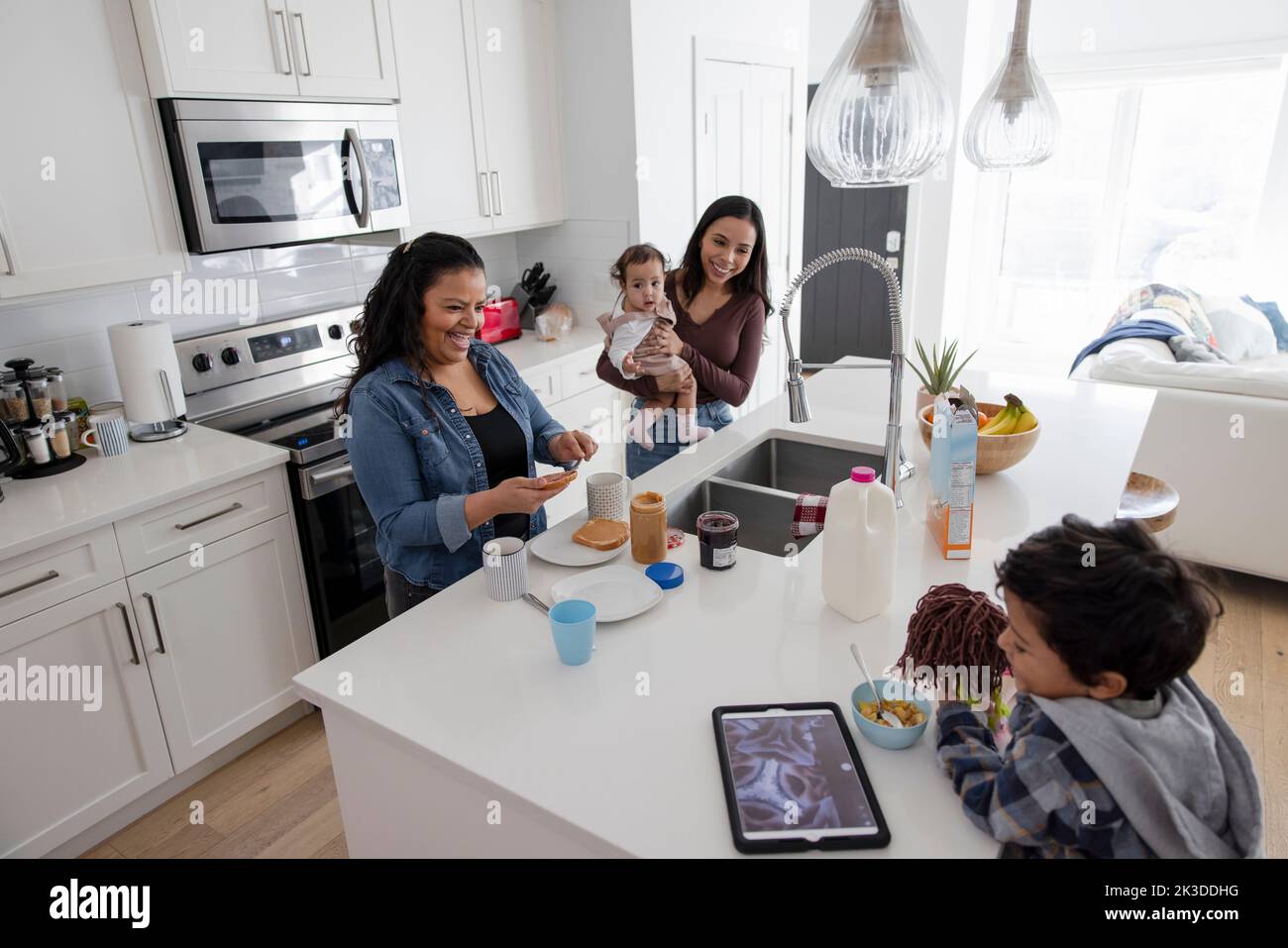 Woman making jam in kitchen hi-res stock photography and images - Alamy