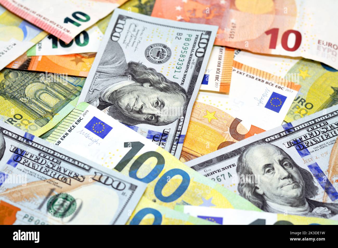 A closeup shot of a pile of green 100 Euro banknote money bills and 100 ...