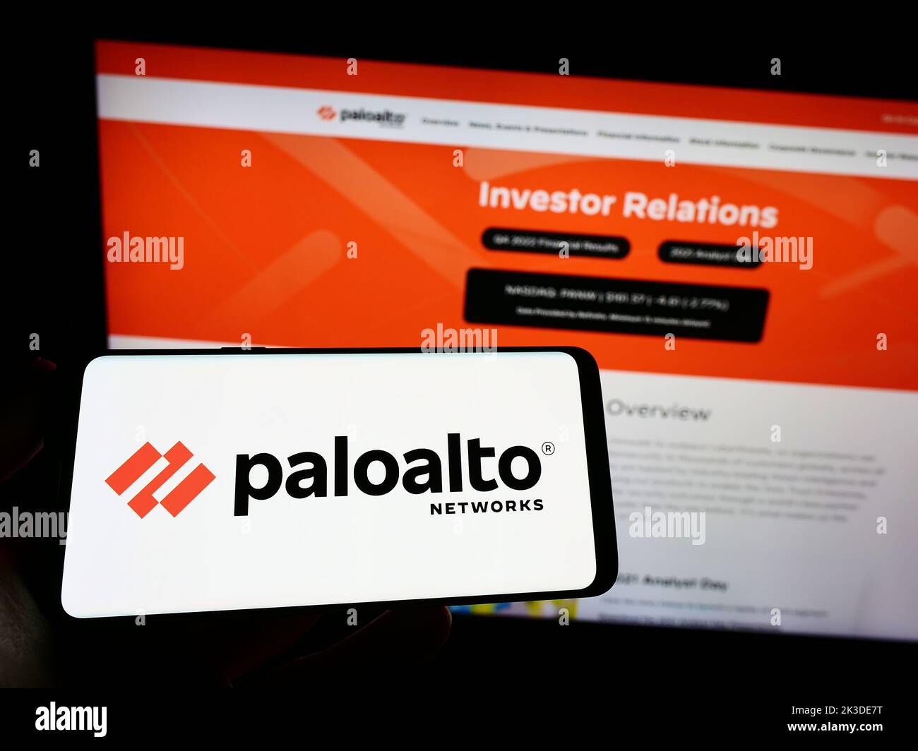 Person holding mobile phone with logo of US cybersecurity company Palo Alto Networks Inc. on ...