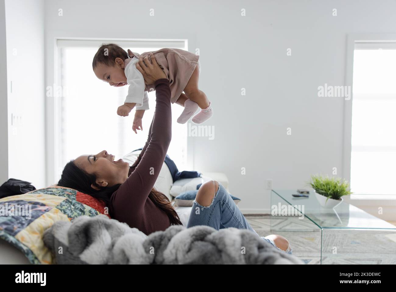 Lifting baby girl hi-res stock photography and images - Alamy