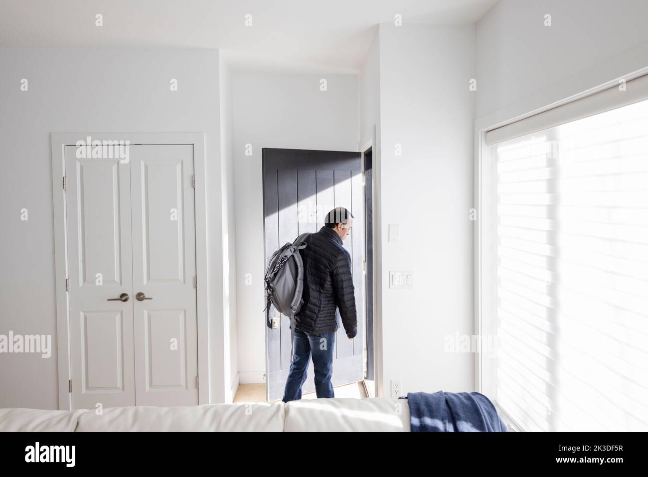 Man walking into door hi-res stock photography and images - Alamy