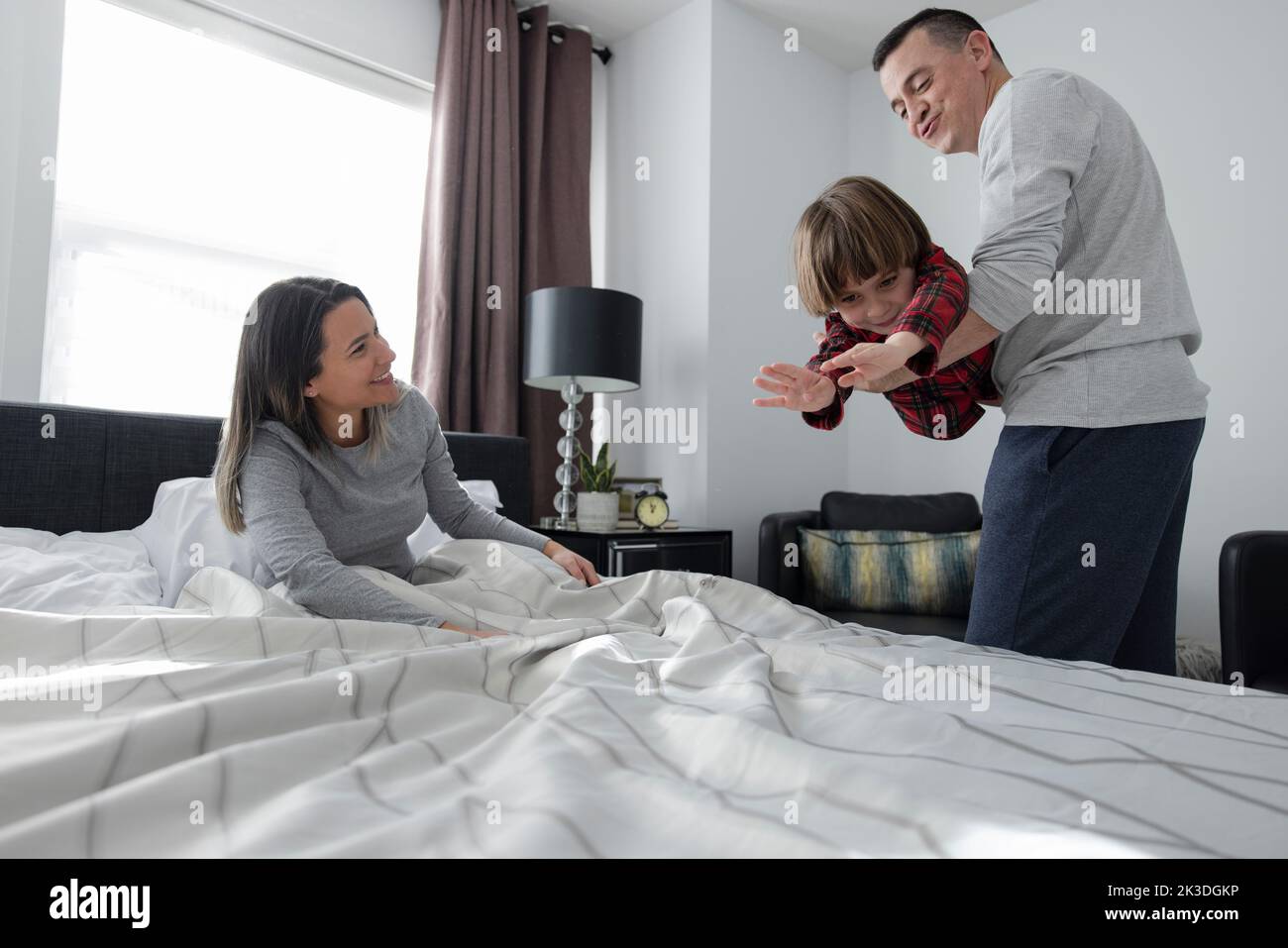 Man standing over bed hi-res stock photography and images - Alamy