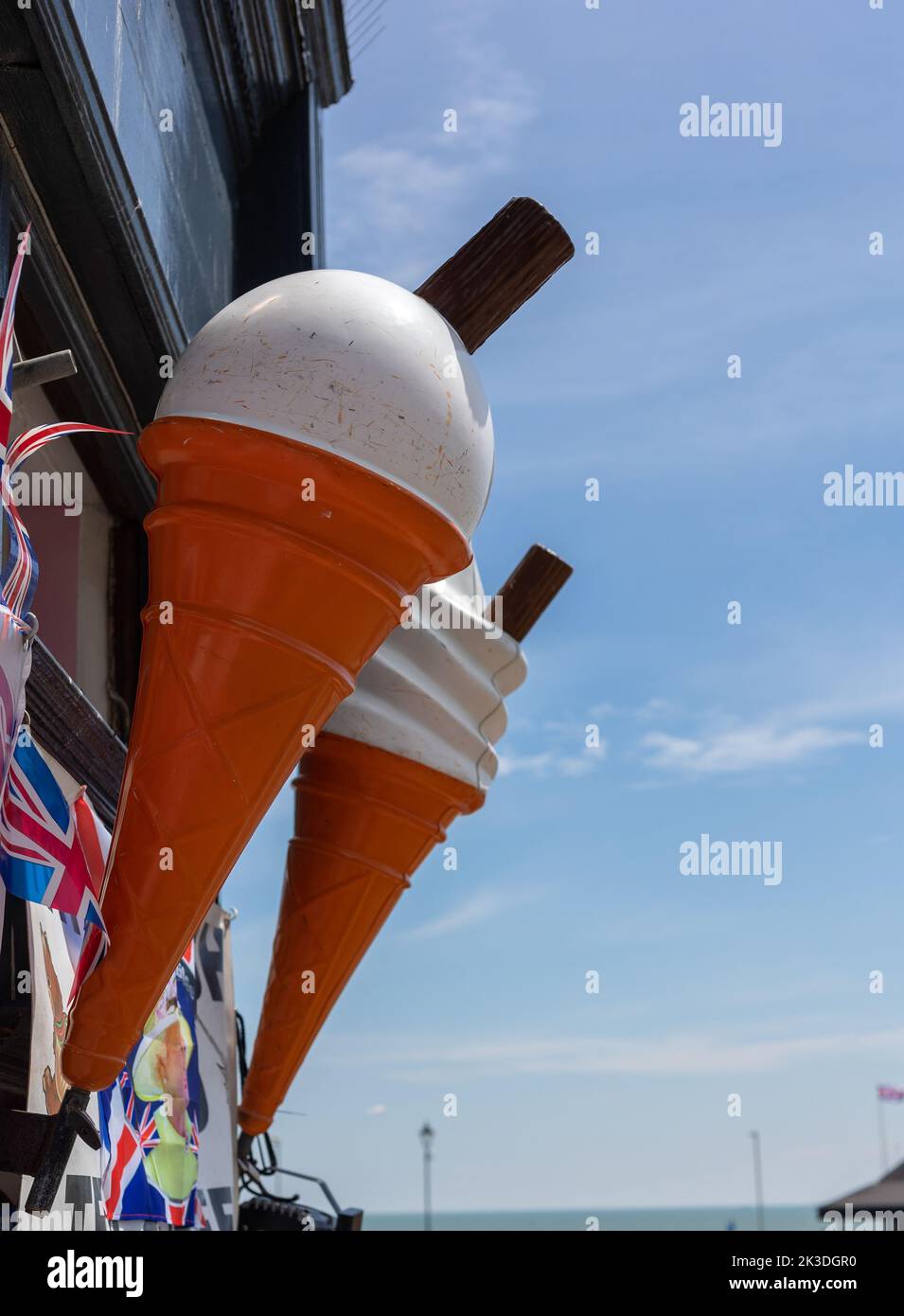 A vertical shot of giant plastic ice cream cone signs in Broadstairs ...