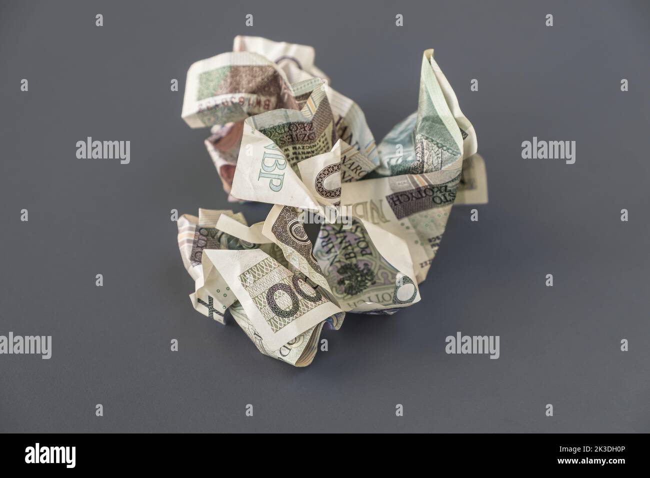 Crumpled polish money PLN. Cash is trash. Trash money, salary ...