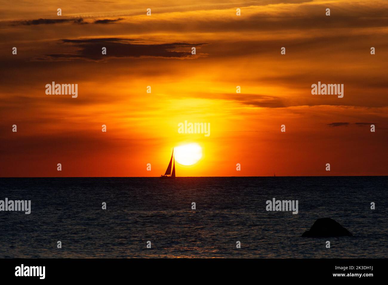 Beautiful orange sunset over the sea, a ship on the horizon Stock Photo ...